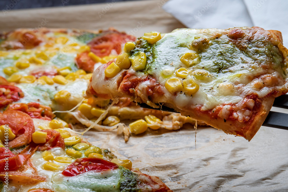 Colorful fresh pizza hot from the oven with mozzarella cheese, corn ...