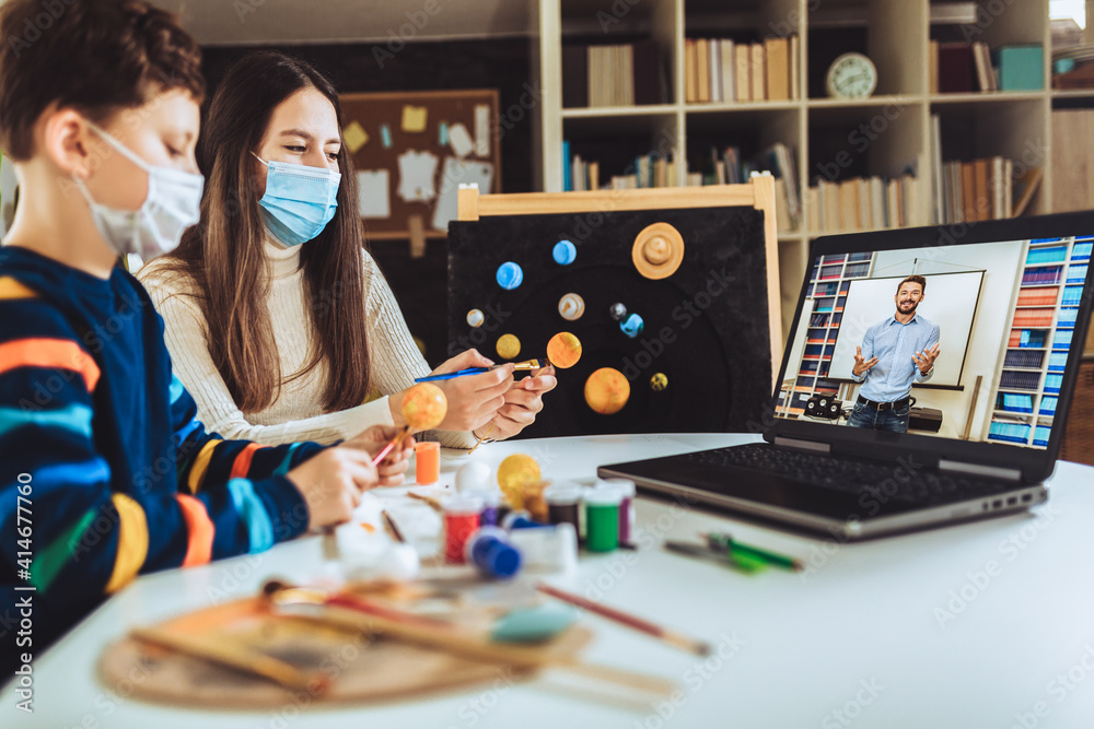 Children with protective mask presenting there science home project ...