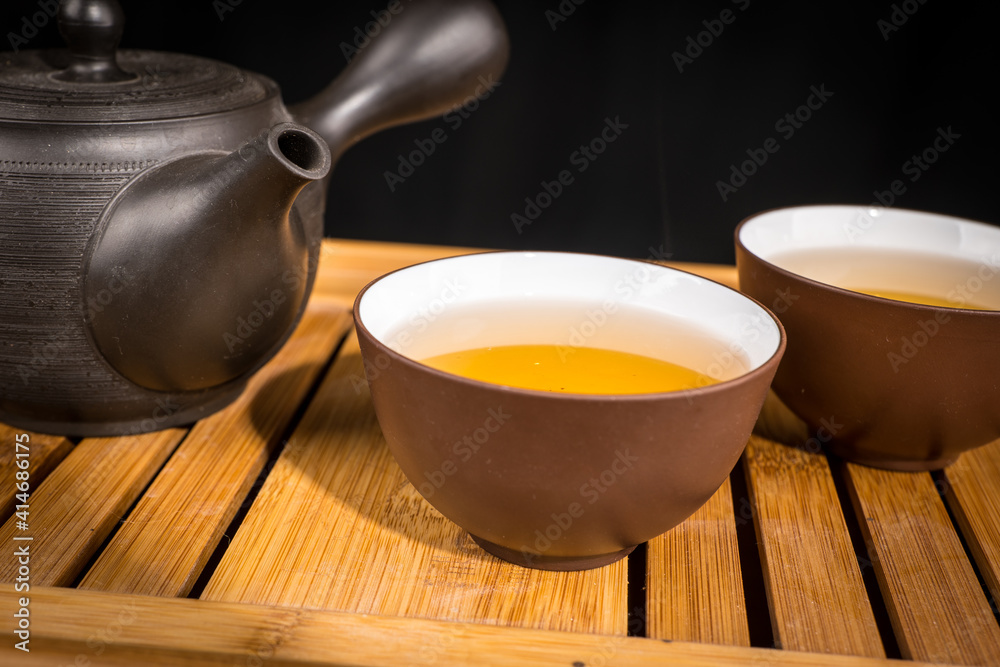 preparation of green loose tea in traditional Japanese ceramics Stock ...