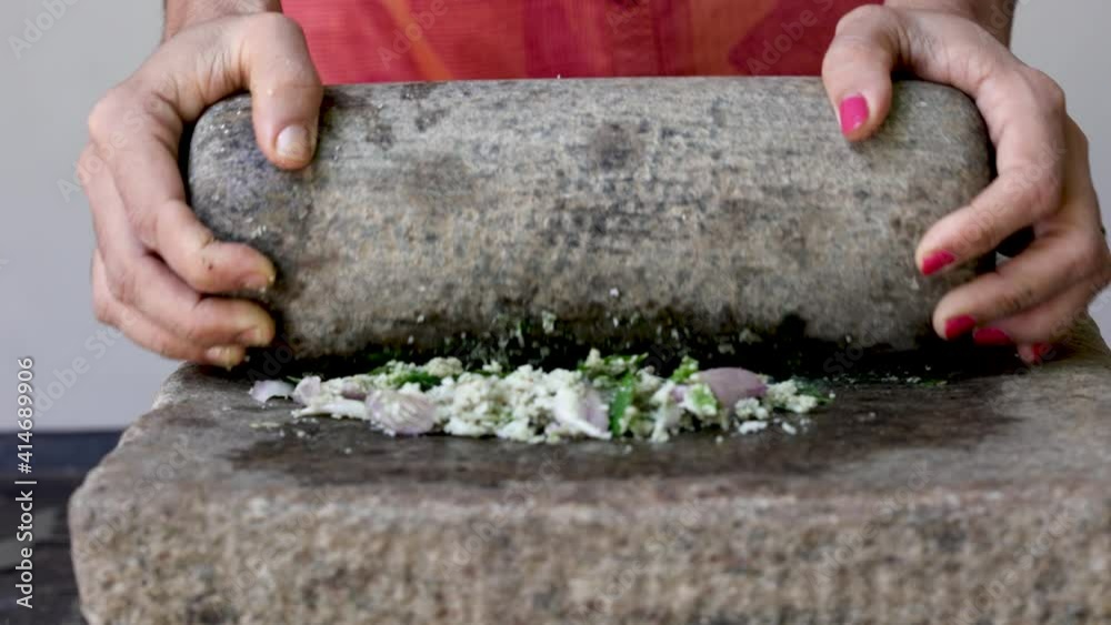 Indian woman hand make coconut Chutney Chammanthi curry grinding grated ...