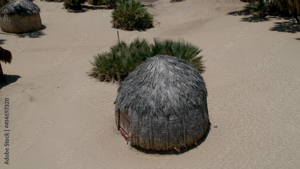 Round traditional hut made from Palm tree leaves of the Turkana people ...
