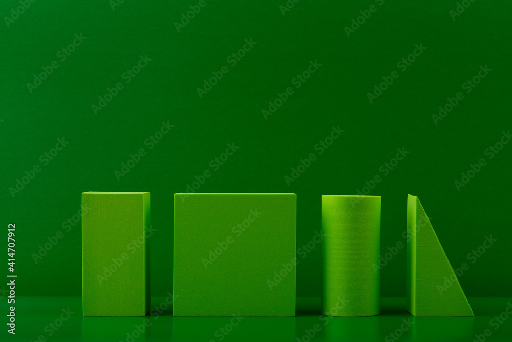 Green monochromatic background with geometric figures against green ...