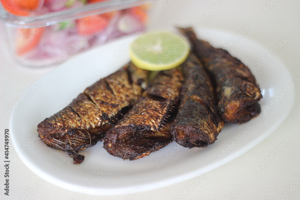Sardines fry is a traditional Kerala fish dish served for lunch. Stock ...
