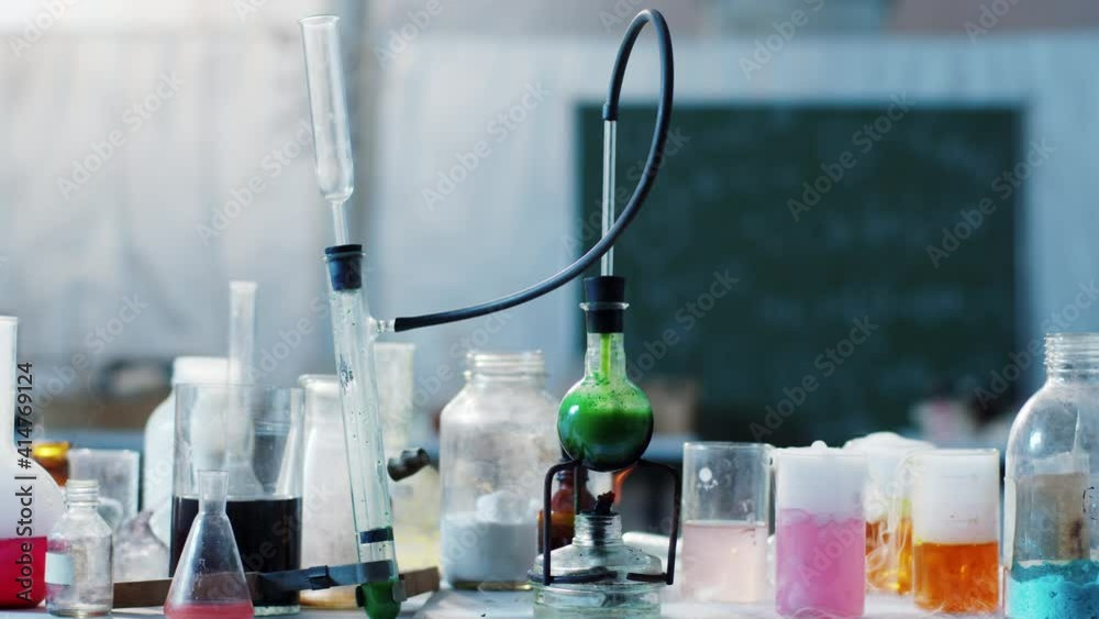 Scientist laboratory experiments table full of chemical reaction ...