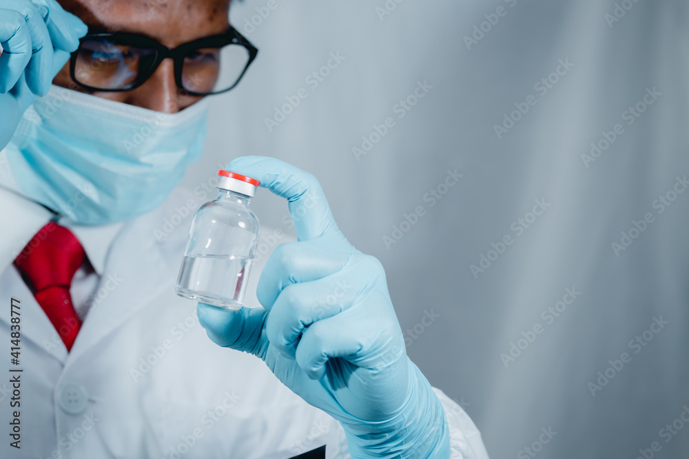 Doctor or scientist wearing antivirus clothing In the laboratory ...