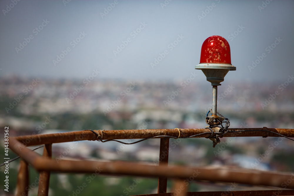 Aircrafts and airplanes warning red light signal lamp on building's ...