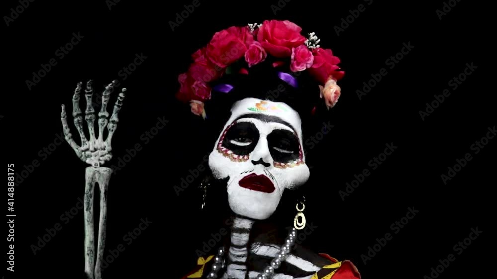Frida Kahlo skull make up for the day of the dead in mexico. Model with ...