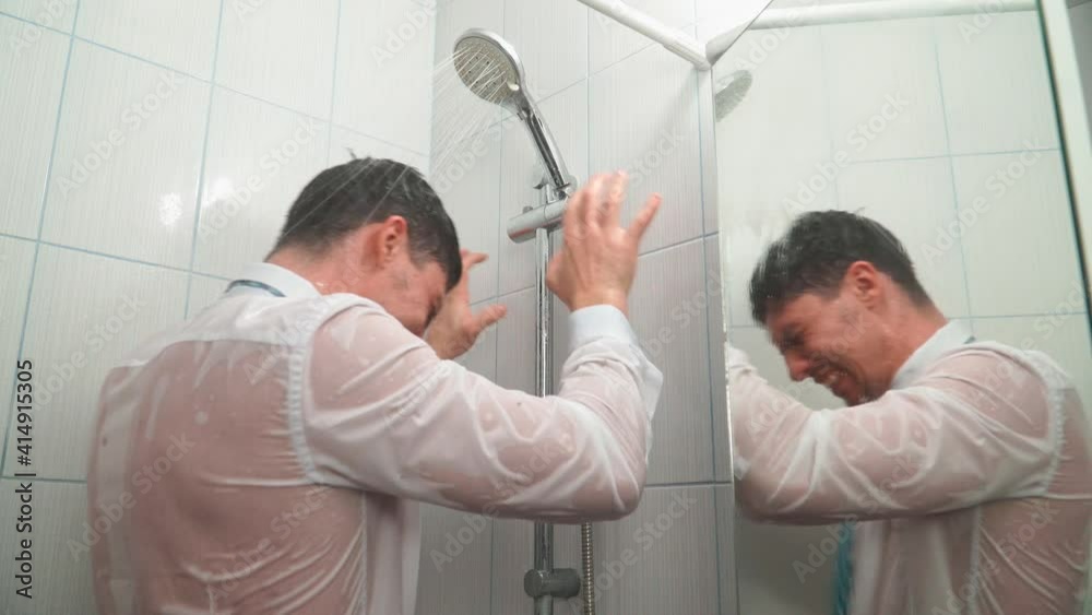 Sad Man in White Shirt and Tie Stands in Bathroom under Shower and ...