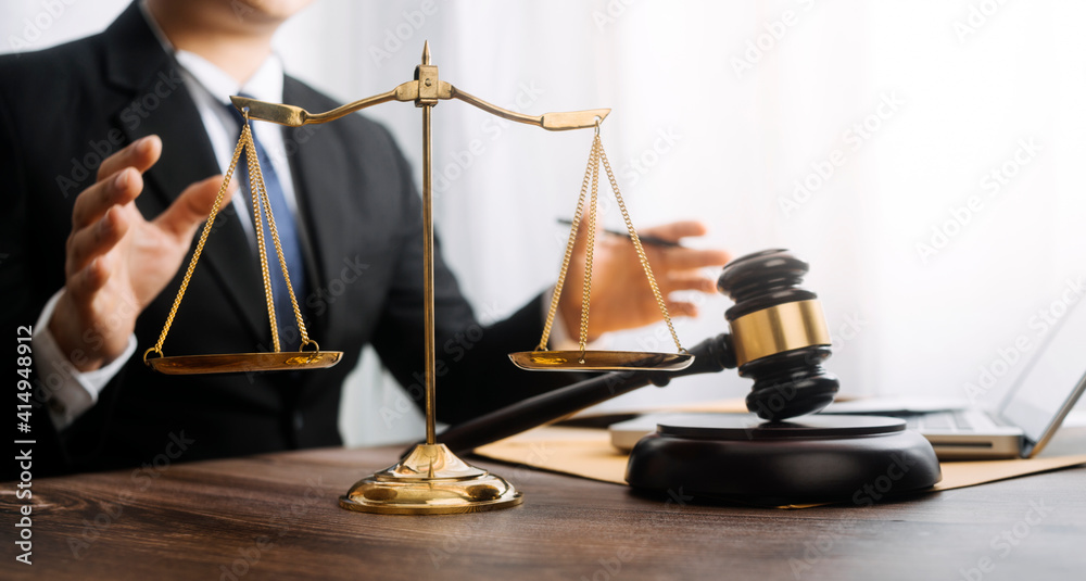 Justice and law concept.Male judge in a courtroom with the gavel ...