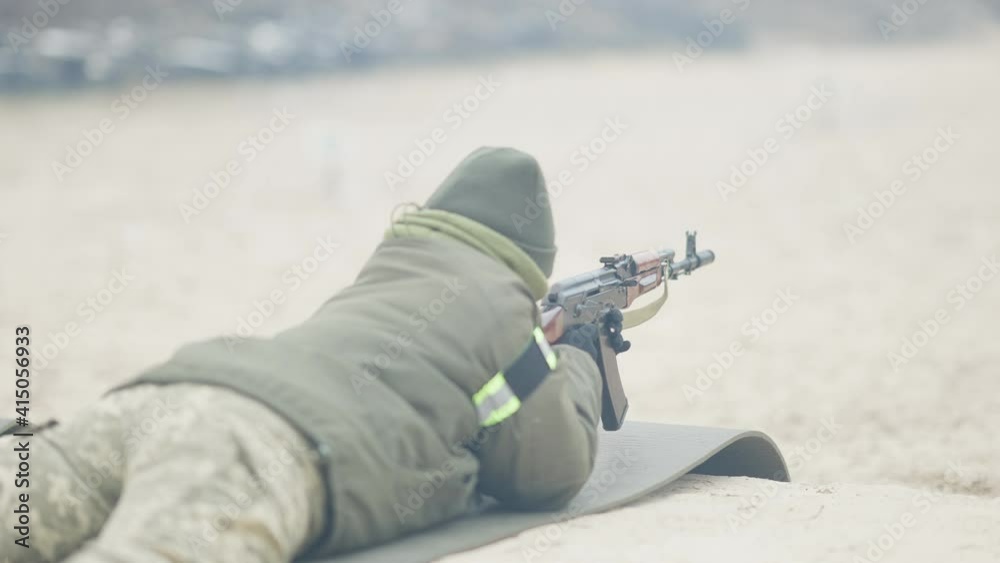 Back view of woman lying on polygon shooting in slow motion from ...