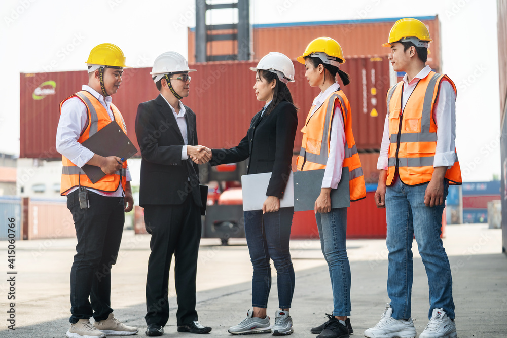 Portrait Of man woman Engineers and workers shaking hands and meeting ...