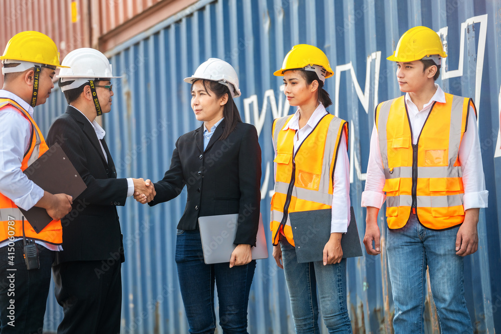 Portrait Of man woman Engineers and workers shaking hands and meeting ...