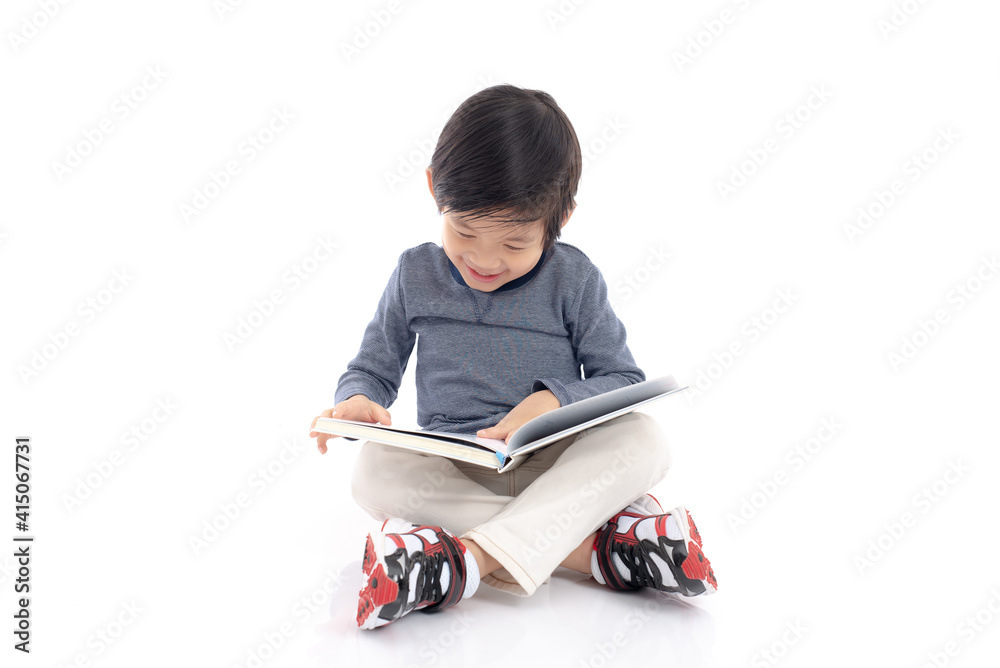 Cute asian boy reading a book on white background isolated Stock Photo ...