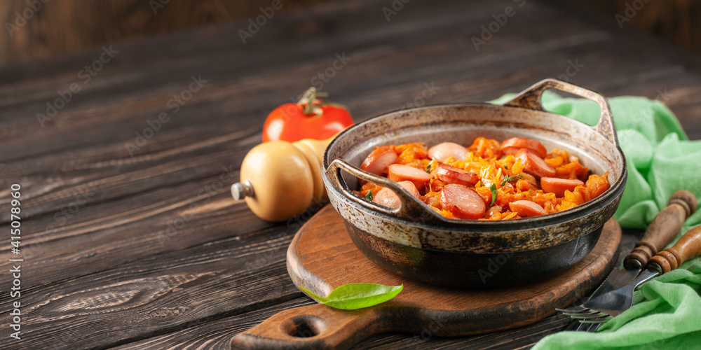 Cabbage stew with grilled sausage in tomato sauce - traditional dish of ...