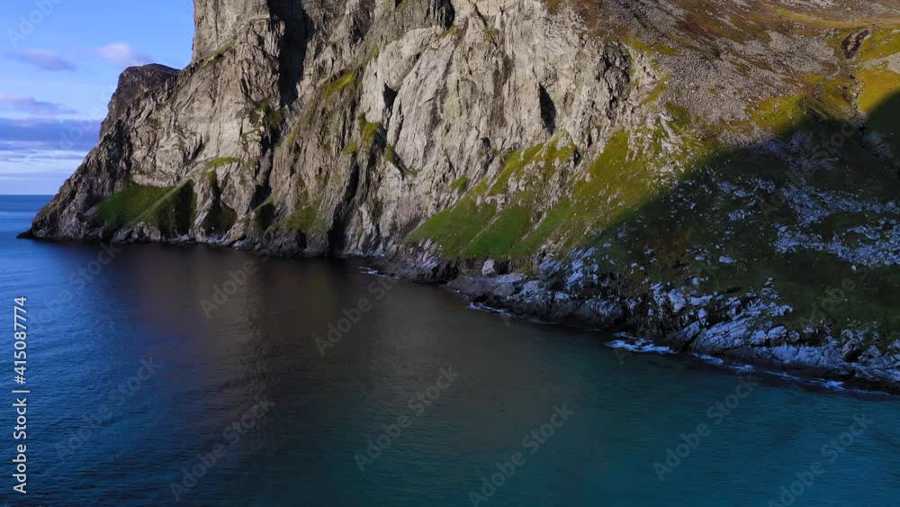 Aerial view of the famous Ryten mountain sinking down to the clear ...