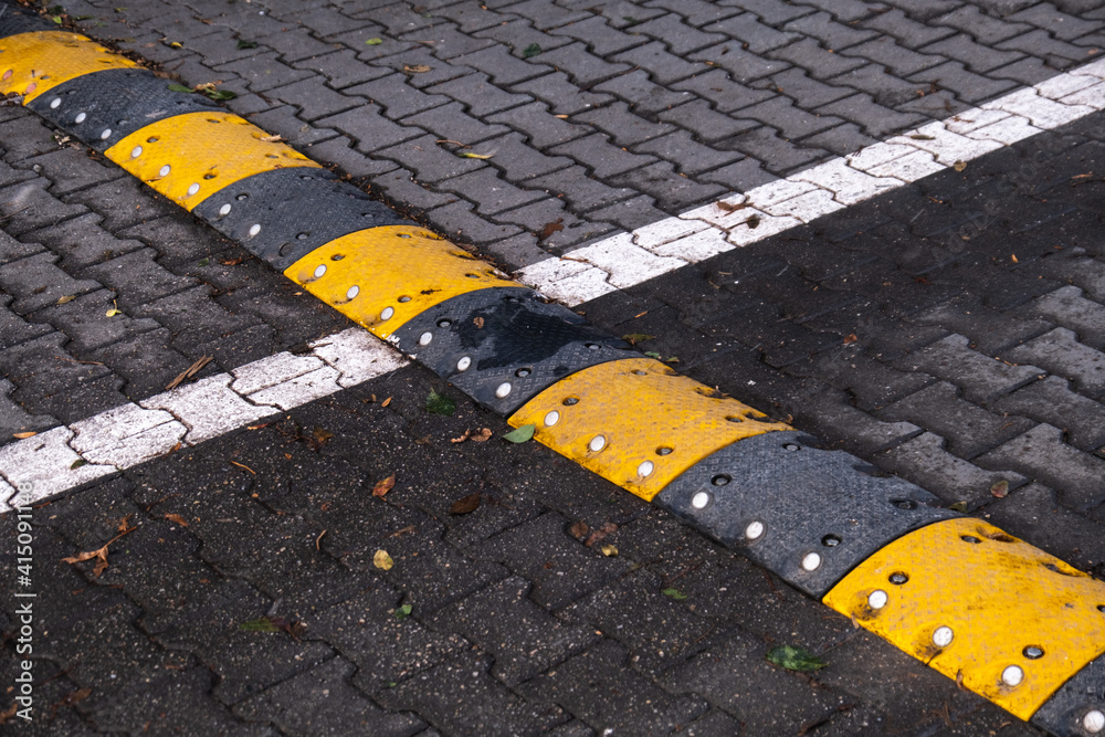 Speed bump on the street Stock Photo | Adobe Stock
