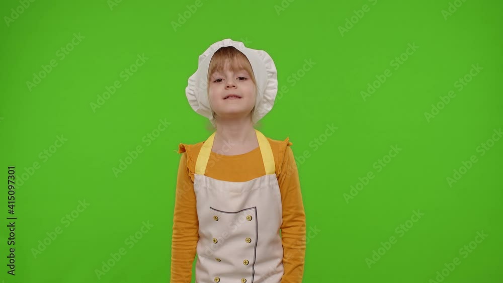 Child girl kid as professional cook chef baker posing, smiling, looking ...