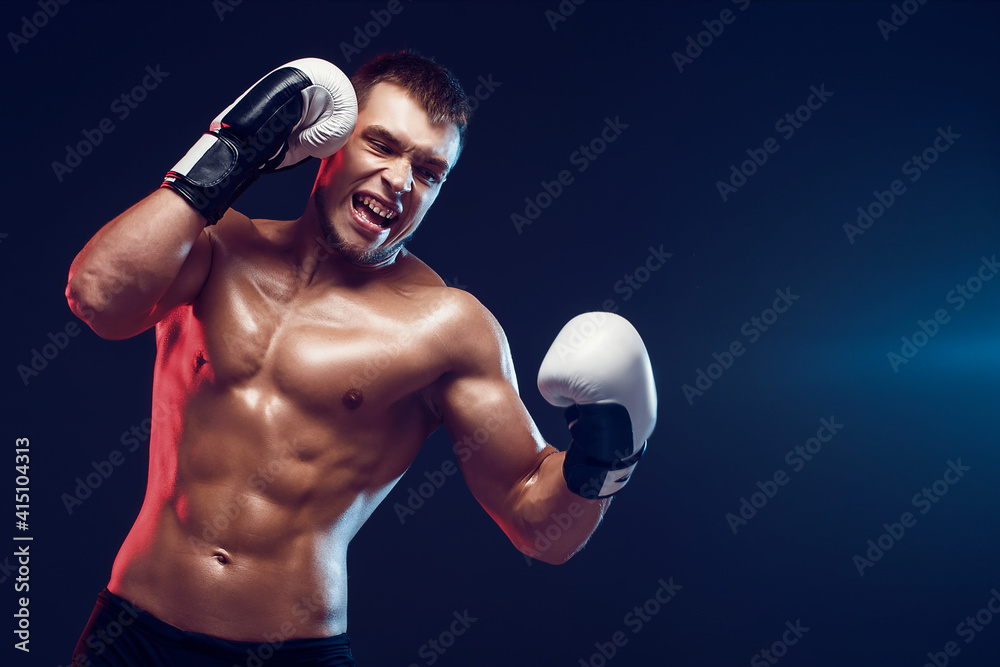 shirtless boxer with gloves on dark background. Isolate Stock Photo ...