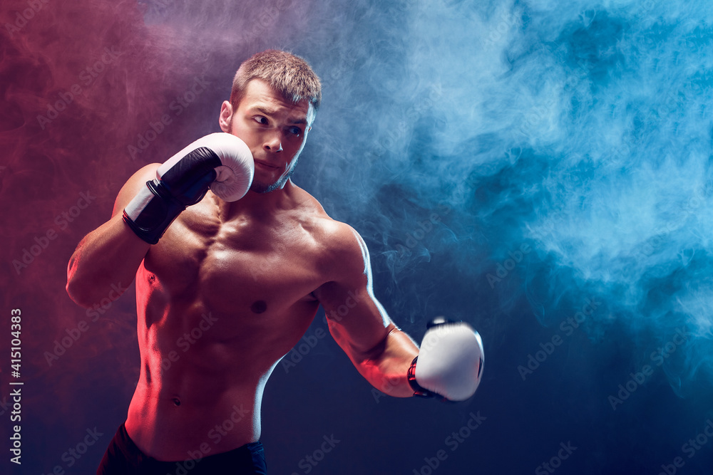 shirtless boxer with gloves on dark background. Isolate Stock Photo ...
