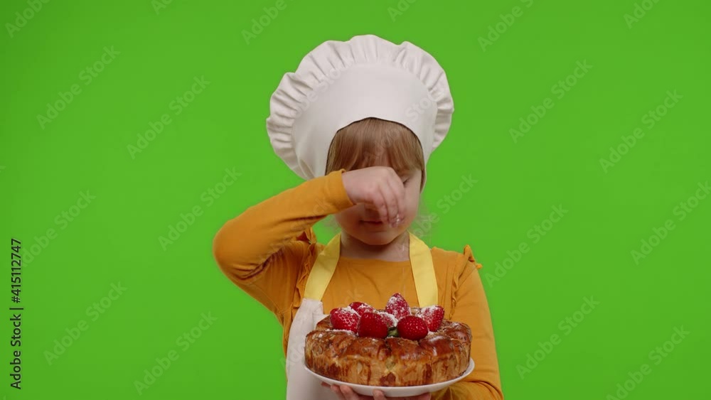 Portrait of little child girl kid dressed as professional cook chef ...
