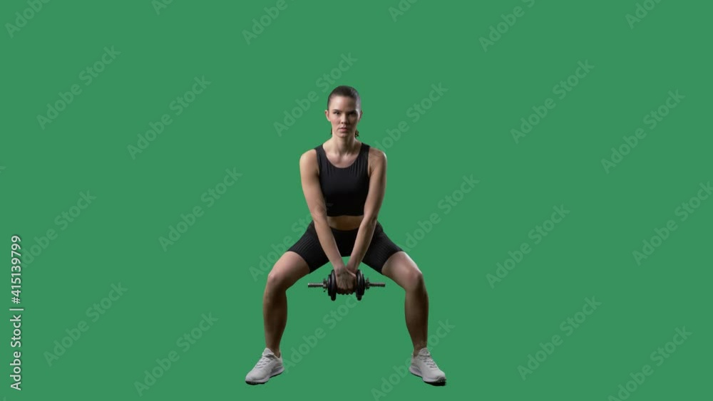 Fit young woman doing squat pulse exercise with dumbbell. Full body on ...