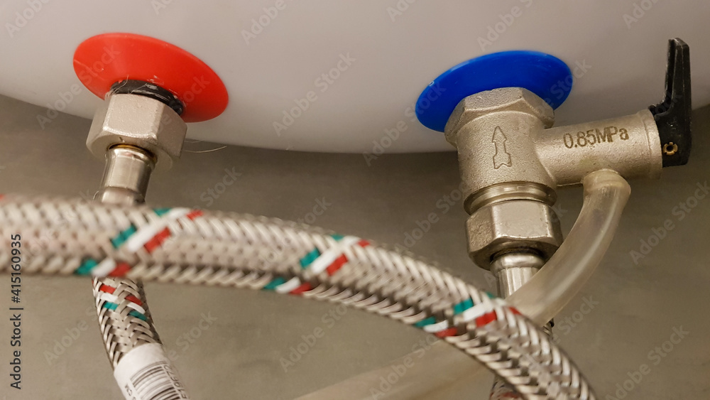 Connection of water supply, hot and cold water to the boiler. Hose for ...