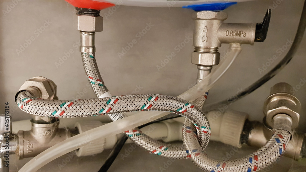 Connection of water supply, hot and cold water to the boiler. Hose for ...