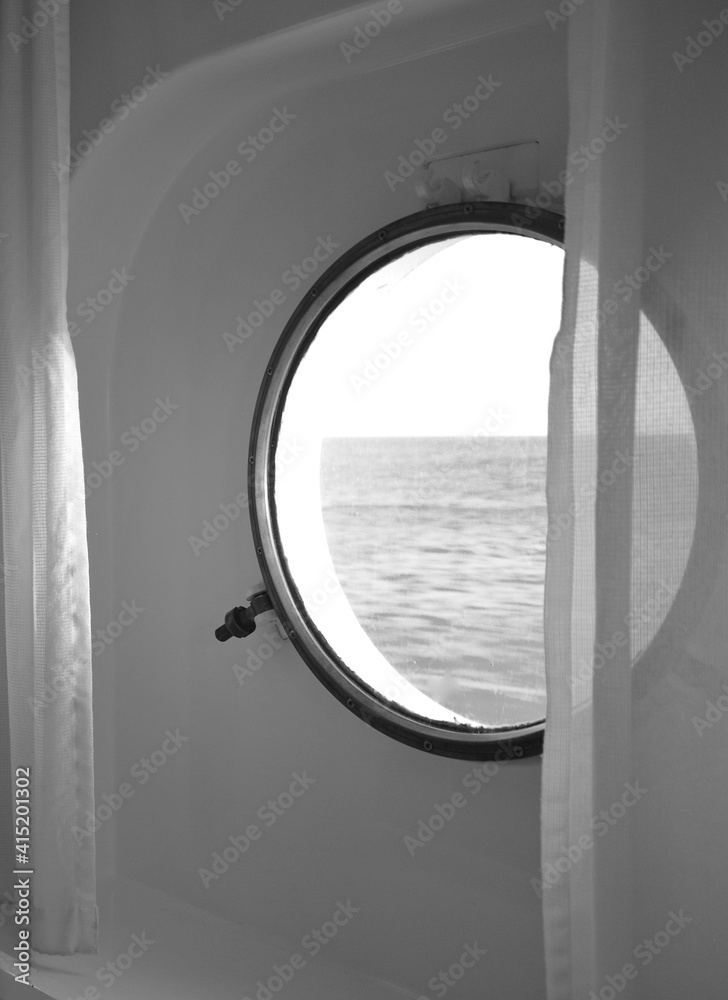 Porthole window inside cabin stateroom onboard classic cruiseship or ...