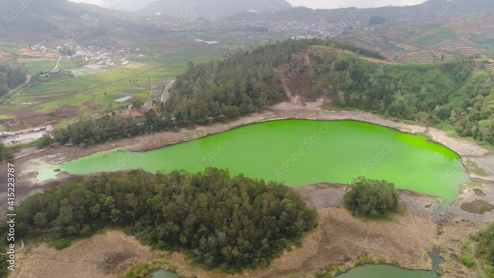 Video Stock volcanic sulfur lake telaga warna in dieng plateau, java ...