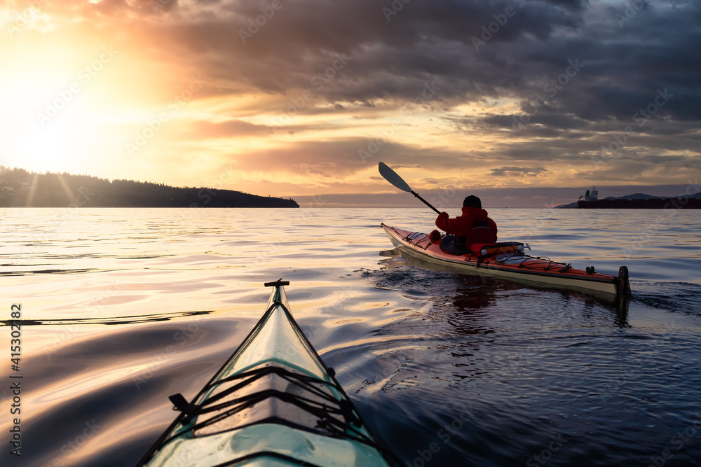 Adventurous Man Sea Kayaking in the Pacific Ocean. Dramatic Colorful ...