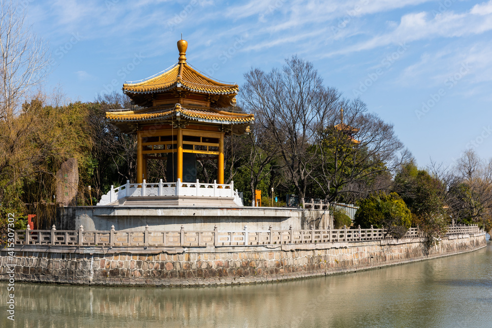 Traiditonal Chinese pavilion by Puhui River in the park of Qibao Temple ...