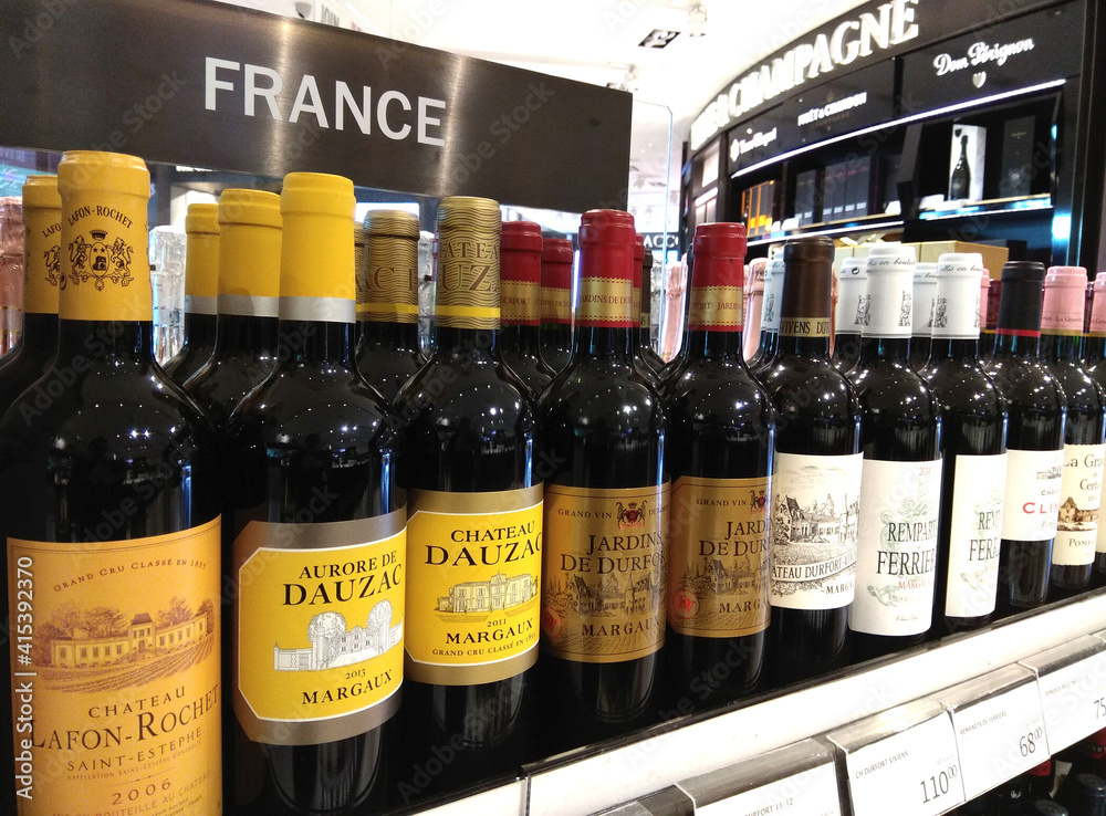 Variety brand of wine from France on store shelf. France is the source ...