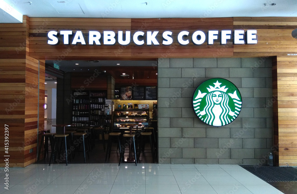 Exterior view of Starbucks store in a mall. Starbucks is the world's ...