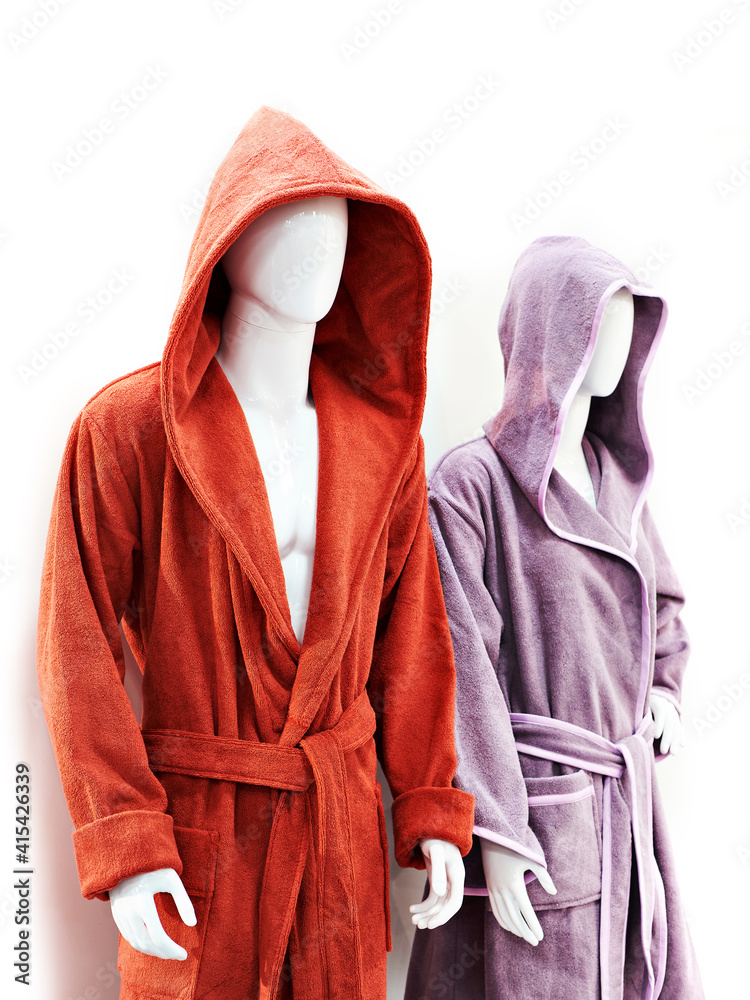 Colored terry robes on a mannequin isolated white Stock Photo | Adobe Stock