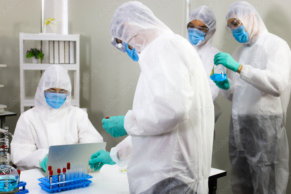 Group of doctors and researchers in sterilize hygiene clothes standing ...