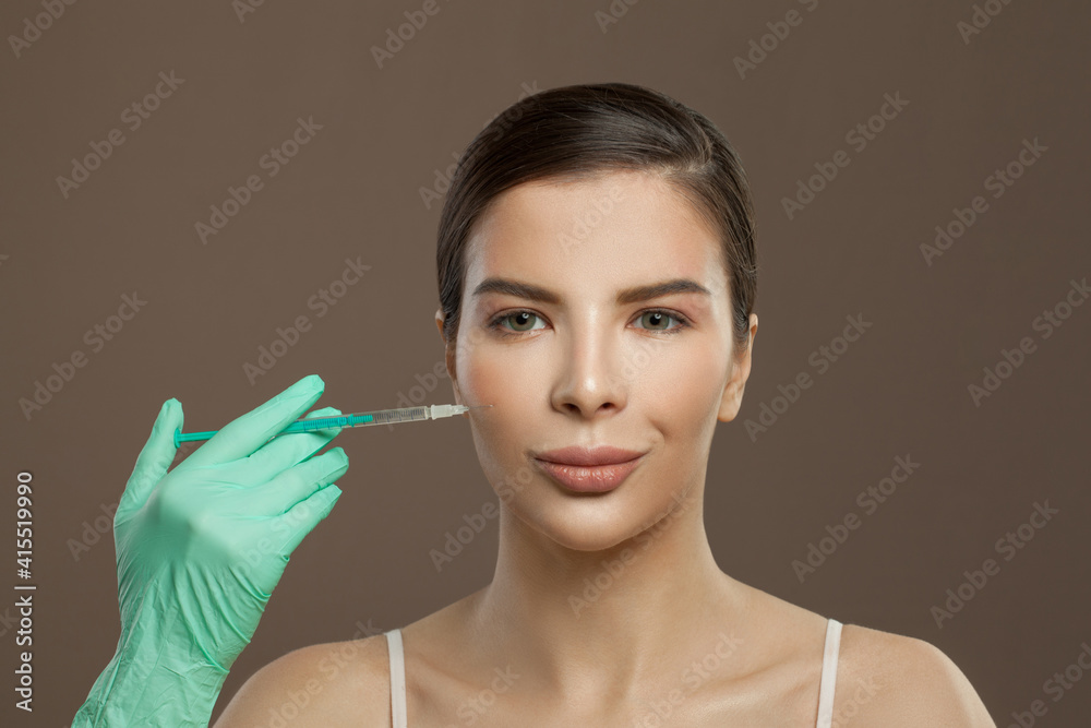 Beauty portrait of attractive woman face with syringe injection ...