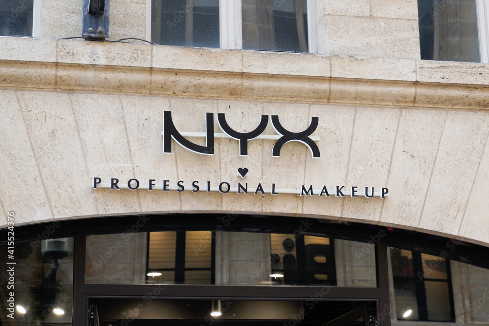 NYX professional makeup brand logo and text store sign of cosmetics ...