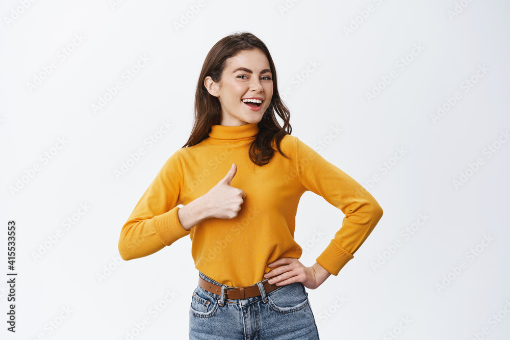 Excellent job. Smiling proud woman showing thumb up and say yes, nod to ...