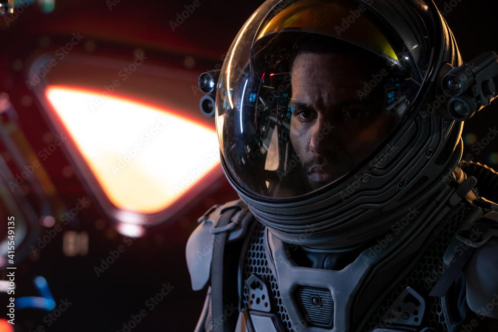 Portrait of African American Black male astronaut inside spaceship ...