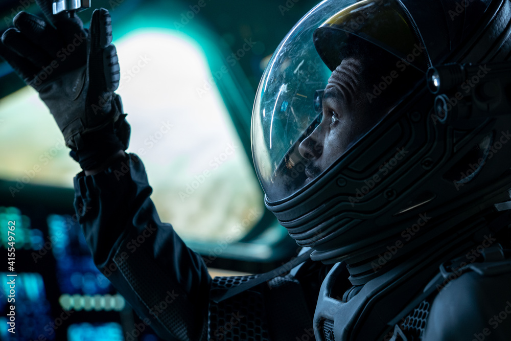 Portrait of African American Black male astronaut inside spaceship ...