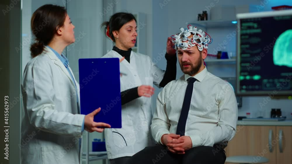 Neuroscience doctor showing on clipboard treatment against brain ...