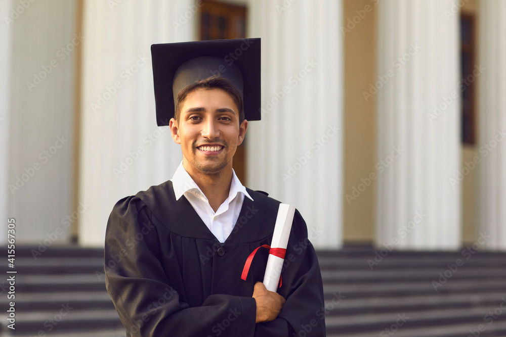 Graduation from university. Young smiling boy university graduate in ...