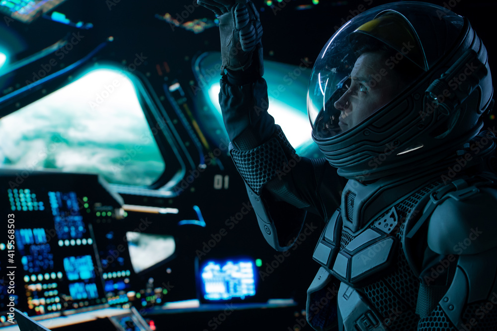 Portrait of Caucasian male astronaut inside spaceship cockpit. Sci-fi ...