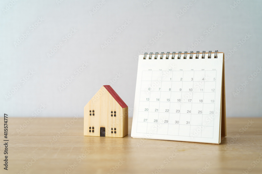 A calendar of the month with model house model. using as background ...