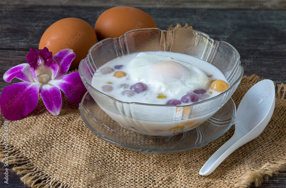 Bua Loy with sweet egg in a transparent bowl placed on a sackcloth with ...