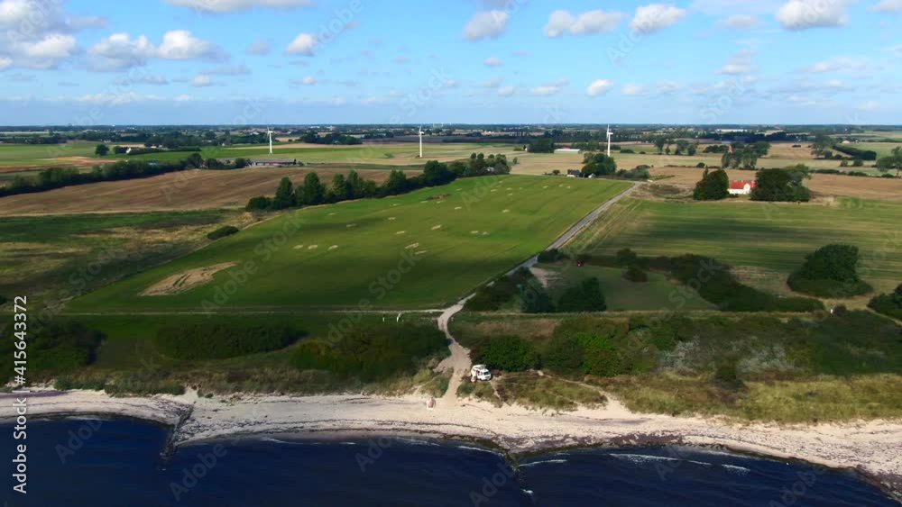 Flying into the sunset at the baltic coast in Marielyst, Denmark. Wind ...