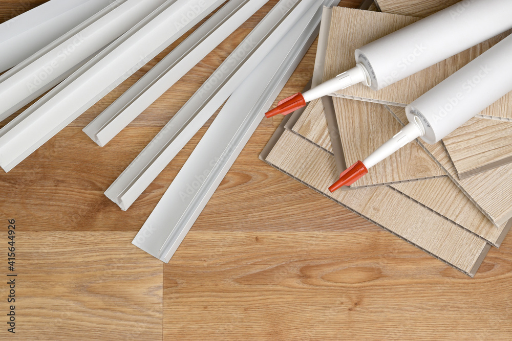 Set of items for PVC ceiling indoor works. Assembly adhesive bottles ...