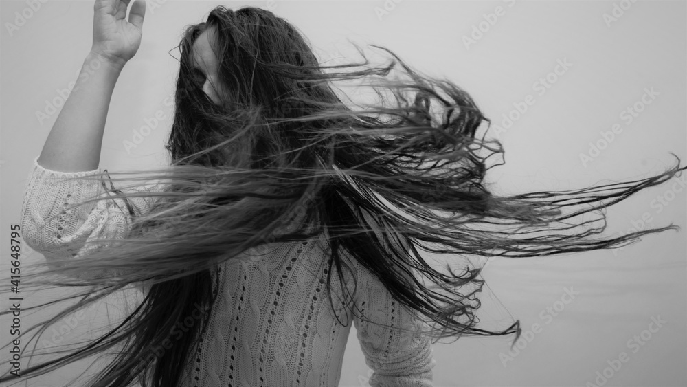 Woman's hair blowing in the studio - moody portraits Stock Photo ...