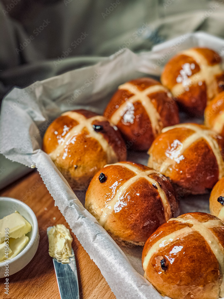 Homemade Hot Cross Buns. A spiced sweet bun made with fruit, marked ...