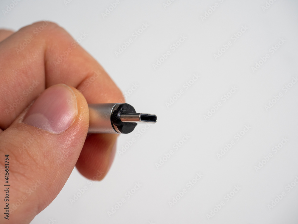 The usb type C cable is collapsible with a magnetic attachment in man ...